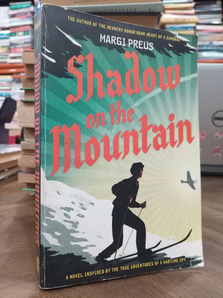 Shadow on the mountain - Margi Preus – Momo Bookstore